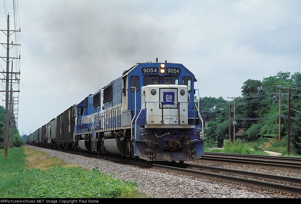 EMDX 9054 and sister, Oakway Lease Units lead an eastbound grain train